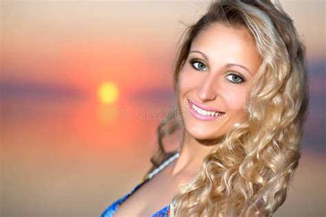 Cheerful Blond Girl Smiling Laughing And Looking Aside At Smth Funny