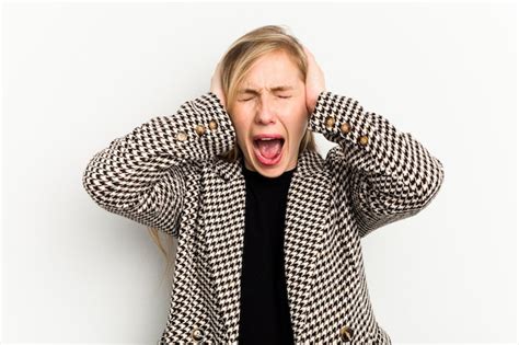 Premium Photo Covering Ears With Hands Trying Not To Hear Too Loud Sound
