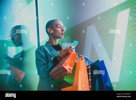 Image Of A Beautiful Young Woman Posing Against A Led Panel Shaved