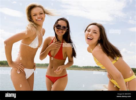 Portrait Of Three Slim Girlfriends In Bikini Laughing At Camera On Hot