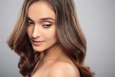 Brunette Girl With Healthy Curly Hair And Natural Make Up Beautiful