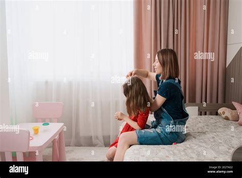 Happy Delightful Aunt Wearing Comfy Jeans Romper Spend Time With Her