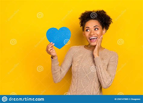 Photo Of Impressed Millennial Brunette Lady Hold Look Heart Wear