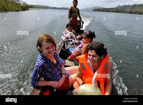 Young Tourist Women Going With Pirogue Toward A Village Of Embera