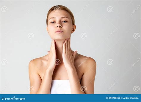 Pretty Young Girl With Well Kept Spotless Smooth Skin Doing Face