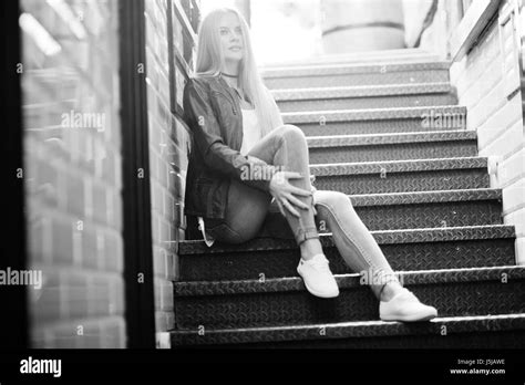 Stylish Blonde Woman Wear At Jeans Choker And Leather Jacket At Street