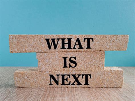 Premium Photo What Is Next Symbol Concept Word Whats Next On Brick