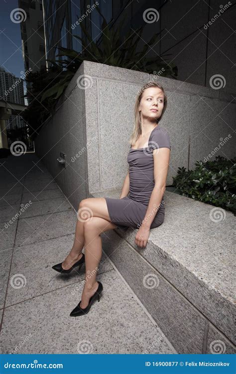Woman Sitting With Legs Crossed Stock Image Image 16900877