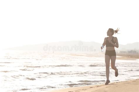 Healthy Young Fitness Woman Runner Running On Sunrise Seaside Tr Stock
