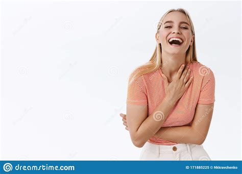 Happy And Carefree Emotive Blond Alluring Woman Having Fun Laughing
