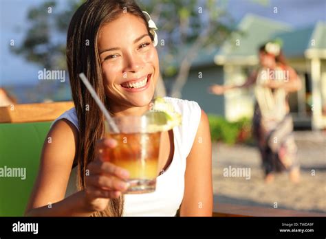 Woman Drinking Alcohol Mai Tai Drink On Hawaii Giving Toast Saying