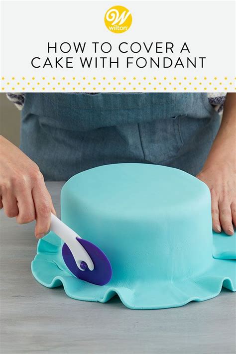 A Person Is Decorating A Cake With Fondant On The Table And Text