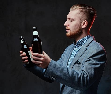 Free Photo Stylish Redhead Bearded Male Dressed In A Suit Holds A