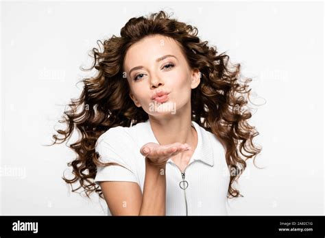 Beautiful Curly Girl In White T Shirt Blowing Air Kiss Isolated On