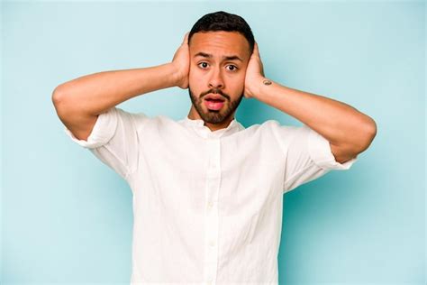 Premium Photo Covering Ears With Hands Trying Not To Hear Too Loud Sound