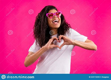 Photo Of Impressed Wavy Millennial Lady Hands Heart Look Empty Space