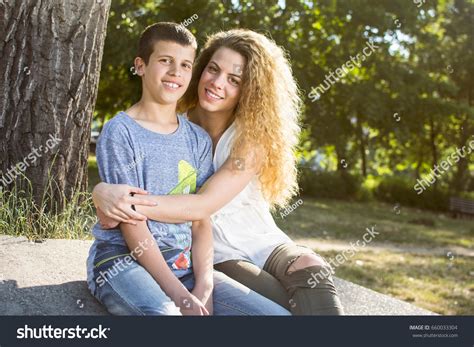 Older Brother And Younger Sister Hugging