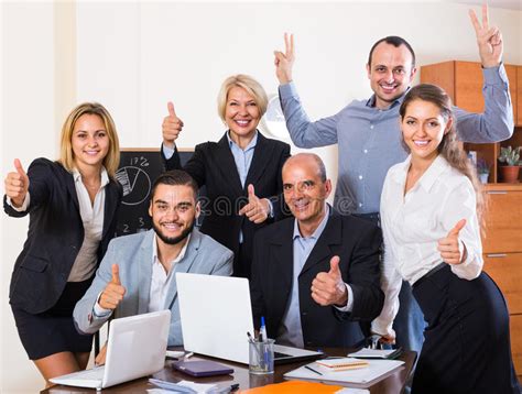 Colleagues Looking At Laptop And Smiling Stock Image Image Of