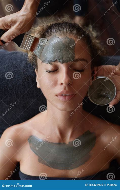 Spa Face Mask Beauty Treatment For Skin Care Beautician Applying Mud