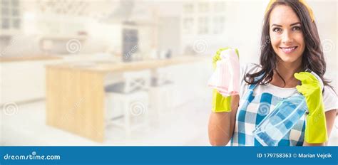 Banner View Of A Smiling Beautiful Woman In Apron Holding Detergent And