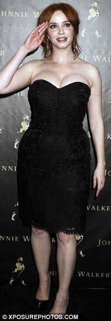 Christina Hendricks Struggles To Contain Her Curves As She Shows Off