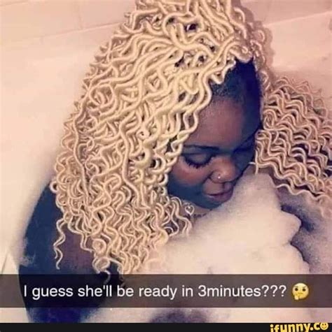 A Woman With Curly Hair Sitting In A Bathtub Filled With Foam And Shampoo