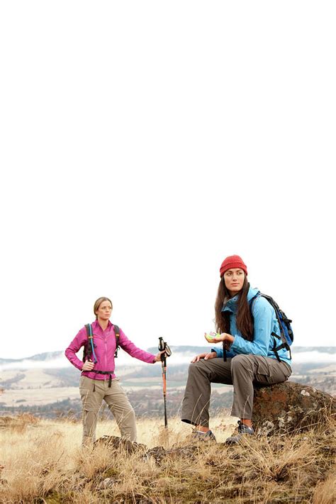Two Females Take A Break To Check Photograph By Jordan Siemens Fine