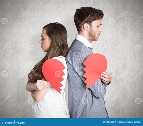 Composite Image Of Side View Of Young Couple Holding Broken Heart Stock