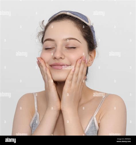 Girl Stroking Her Face After Waking Up Morning Cosmetic Procedures