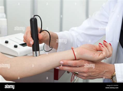 Dermatologist Examining Birthmarks And Moles On A Female Patient