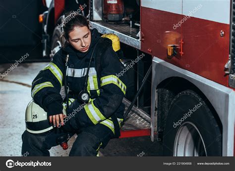 Tired Female Firefighter Uniform Helmet Sitting Truck Fire Station