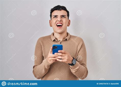 Non Binary Person Using Smartphone Typing Message Angry And Mad