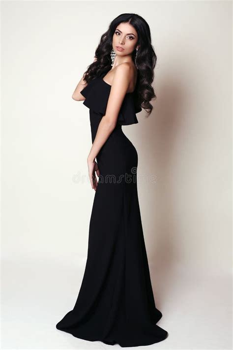 Gorgeous Woman With Dark Hair In Elegant Black Dress Stock Image