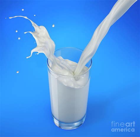 Pouring Milk Into A Glass With Splash Photograph By Leonello Calvetti