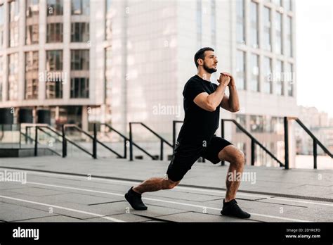 Fit Man Doing Lunge Forward Sport In Big City Concept Strong Man