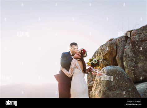 Romantic Newlywed Husband Kissing Hin New Wife In Sunset Lights On