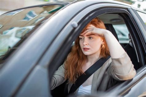 Free Photo Nervous Female Driver Sits At Wheel Has Worried Expression