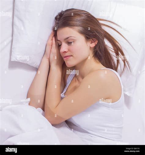 Beautiful Young Woman Sleeping In The Bed Relaxing And Peaceful Stock