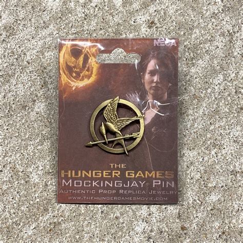 Image result for Mockingjay Pin Hunger Games Symbol