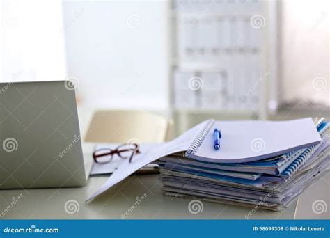 Image result for Stack of Paper by Computer