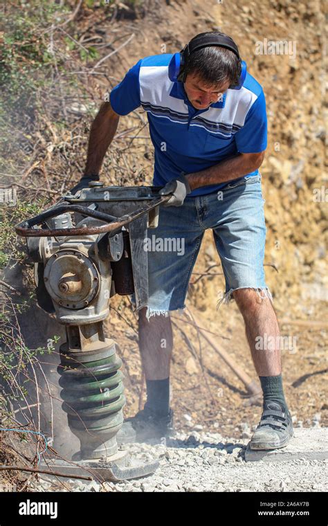 Image result for Indian Man Using Soil Compaction Machine