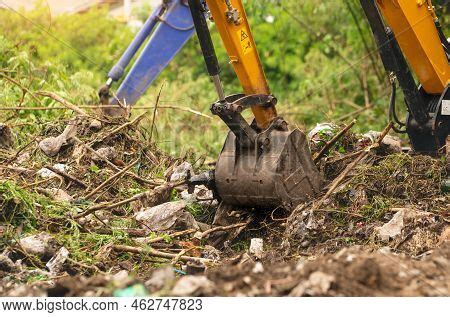 Image result for Backhoe Digging