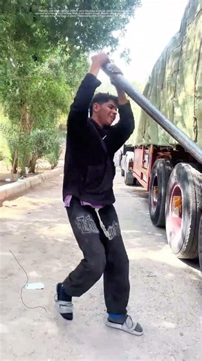 Workers Employ Iron Pipes for Effective Load Stabilization