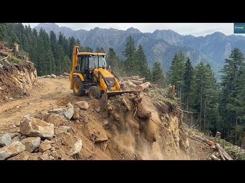 NEW VIDEO-Pushing Huge Loads of Dirt off the Mountain Cliff for a Logging Deck Road