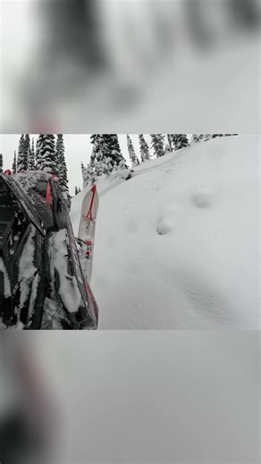 A snowmobile kicks off an awesome ride through a winter wonderland. Witness the start as the driver gets everything just right. Ready for adventure! #Snowmobile #WinterAdventure #SnowyLandscape #OutdoorFun | Snowmobile