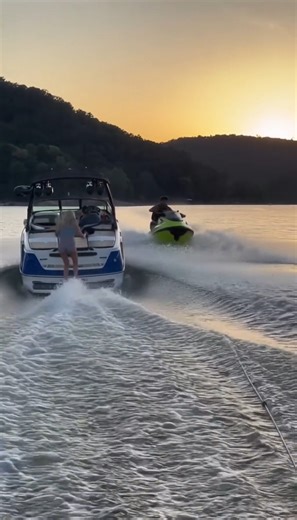 Jet Ski Rider Flung Into Boat After High-Speed Collision on Open Water Lake Travis, TX — A day of carefree boating took a sudden and dangerous turn when a jet ski rider collided with the back of a moving boat, launching the rider through the air and straight into the vessel in a split-second crash caught on camera. The footage shows a jet ski racing alongside a speedboat at close range, the rider standing and gesturing as if playfully showing off. In the next moment, the jet ski veers directly i