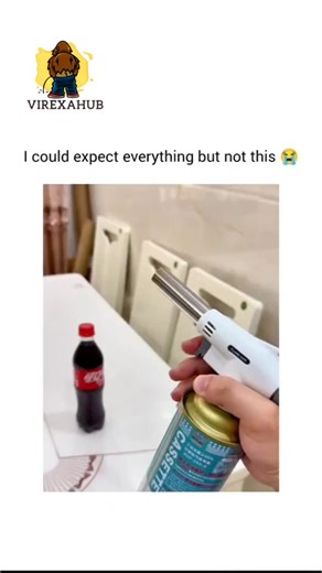 VIREXAHUB on Instagram: "A person uses a handheld butane torch to heat the bottom of a small plastic bottle of Coca-Cola, causing the plastic to quickly shrink, contract, and warp into a tiny, shriveled version of itself. The unexpected result is a miniature, melted soda bottle that looks like it just stepped out of a cartoon. It’s an oddly satisfying and surprising way to see the impact of heat on plastic."