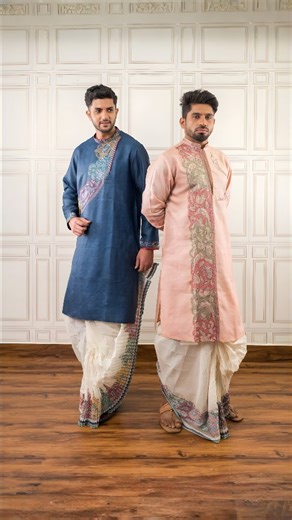 For the man who wears tradition with quiet confidence. From Shubhroja Sen’s Highway Kurta Series, this peach and blue Tussar Panjabi carries Kantha motifs that flow along soft curves and broad lanes. The stitches guide the eyes gently across the fabric, tracing stories in every line. The natural sheen of Tussar meets delicate handworked embroidery, creating a look that blends heritage and contemporary ease. Pair it with our Kantha embroidered cotton dhoti for a refined, cohesive ensemble. Visit 