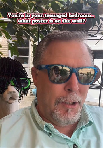 If you remember back when you were a teenage do you remember all of the posters you used to have hanging on your walls? You're in your teenage bedroom... what poster is on the wall?