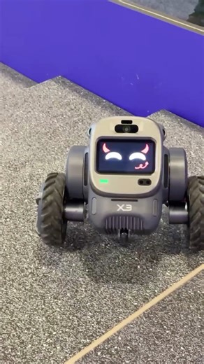 The Verge on Instagram: "Would you trust your kids with a robot? The Rovar X3 is designed to handle the outdoors, from daily walks to hikes, and act as a sports companion and even a babysitter. It’s not very tall, just about 1.5 feet fully standing, but Sentigent Technology, the startup behind the Rovar, says it could carry a backpack on a hike and hang out with your kids in the park. But don’t go out for too long: the battery life range is between 4 and 6 hours. #ces2026 #robot"